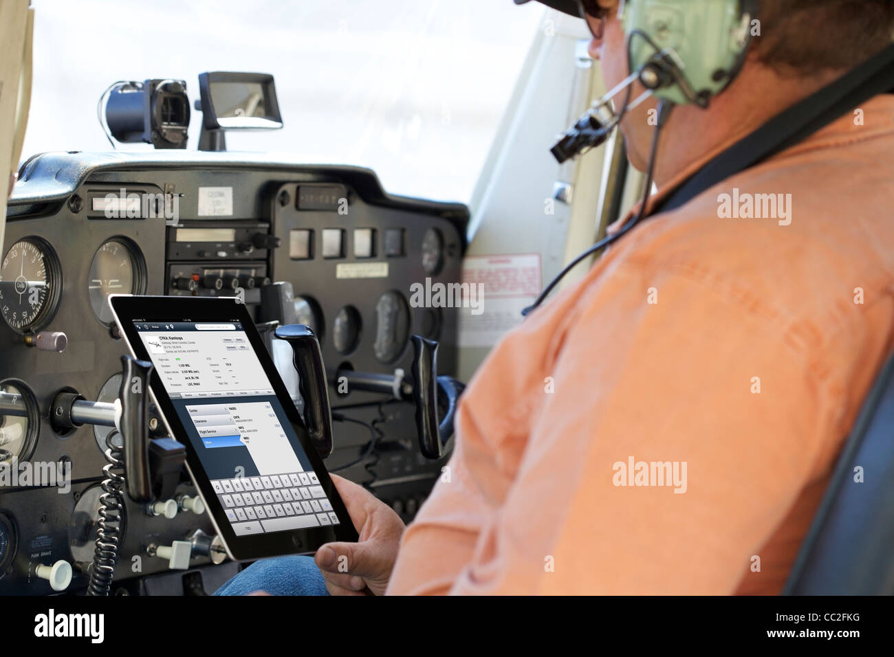 Private airplane pilot ready to fly with his iPad showing weather ...