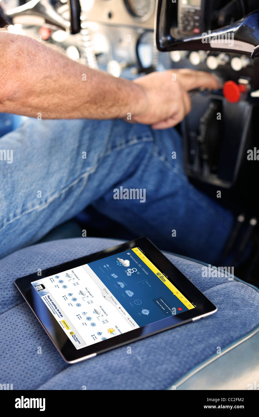 Private airplane pilot ready to fly with his iPad showing weather ...