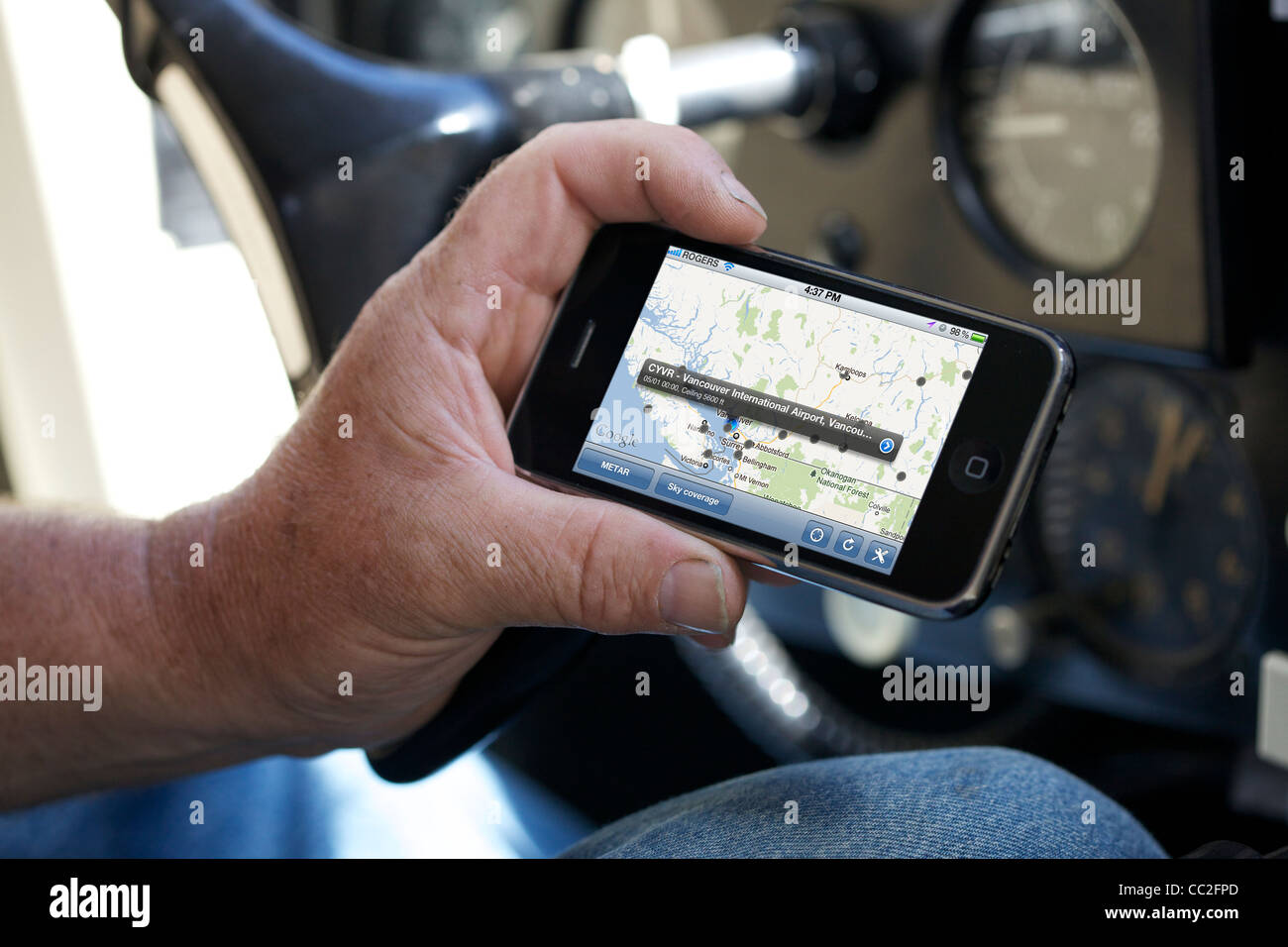 Private airplane pilot checking weather condition before flying with ...