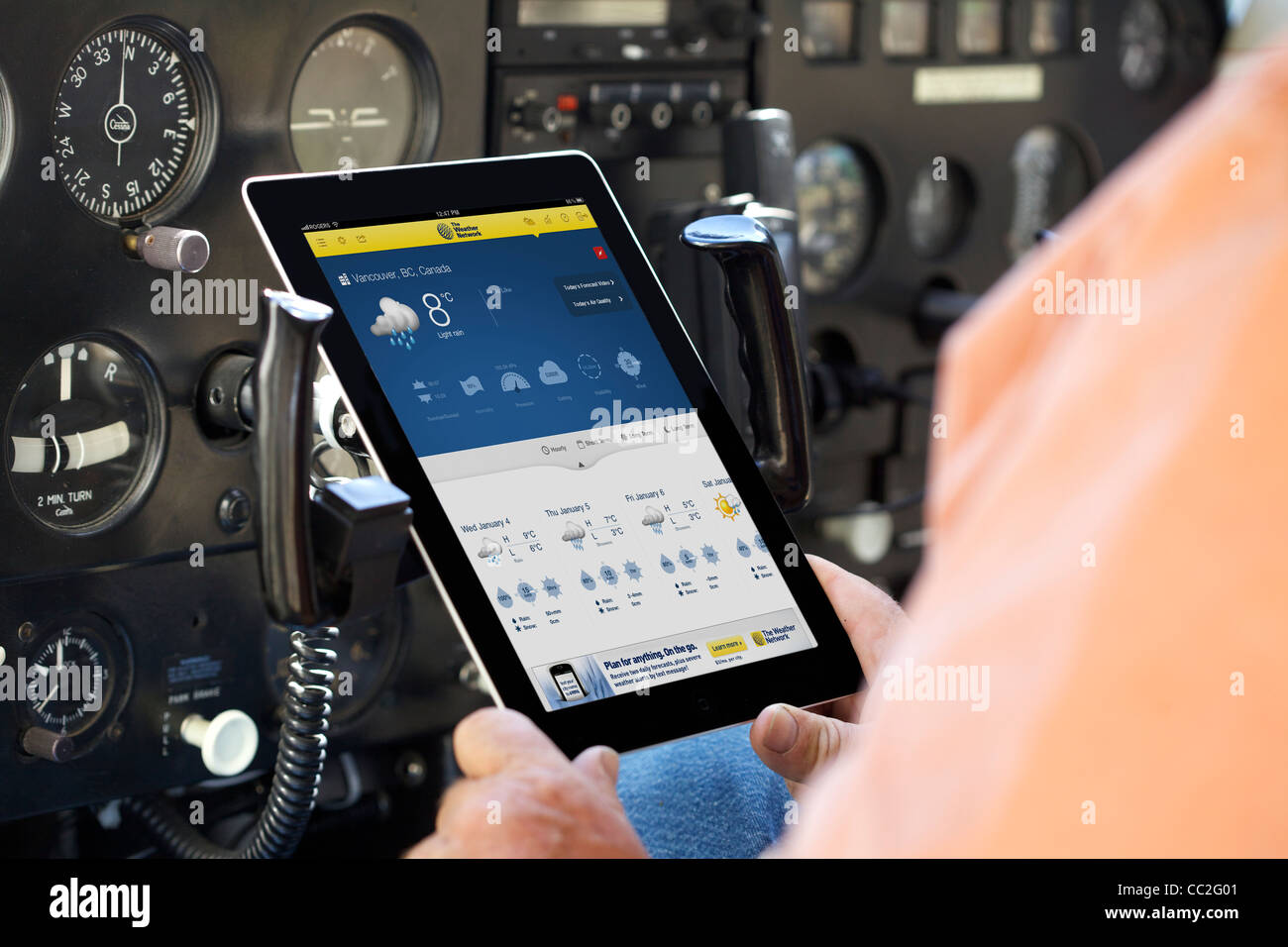 Private airplane pilot checking weather condition before flying with ...
