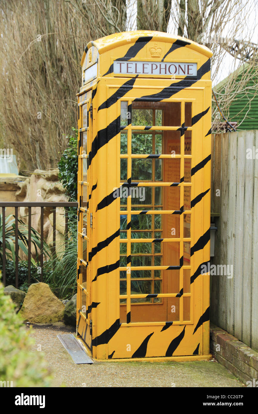 A wildlife themed traditional British Telecom BT red telephone box at ...