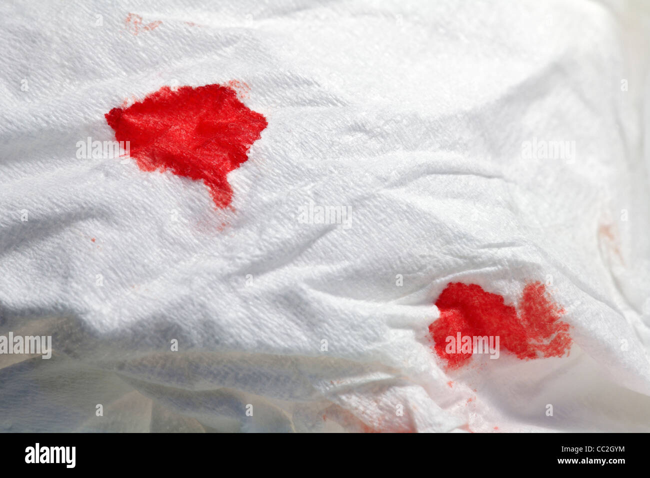 fresh blood spots on a tissue Stock Photo - Alamy