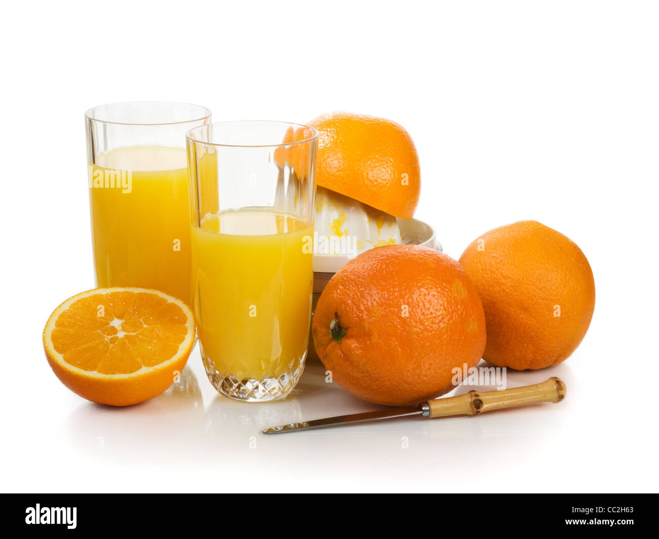Freshly squeezed orange juice on white background Stock Photo - Alamy