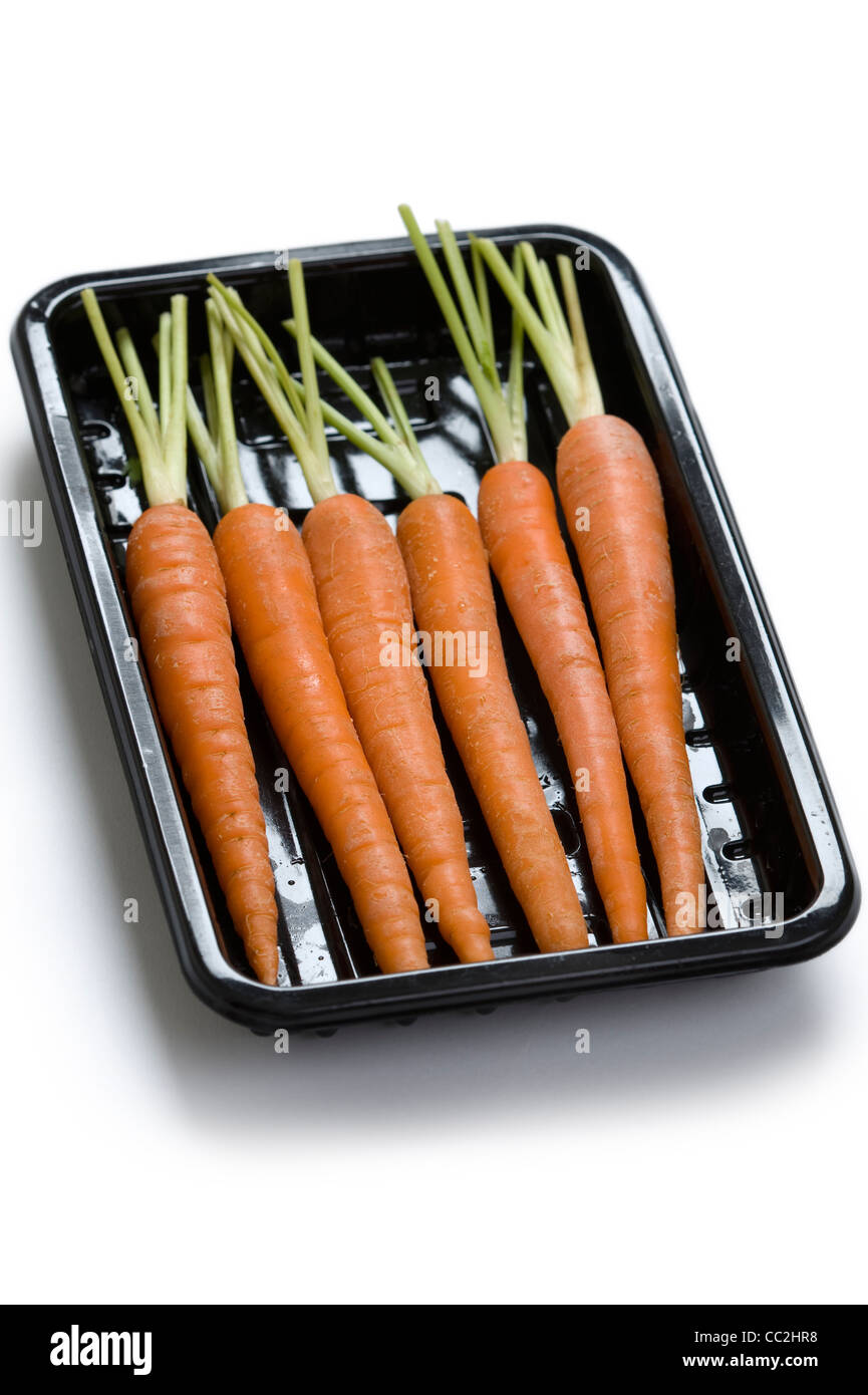 harvested carrots in a black plastic food tray Stock Photo - Alamy