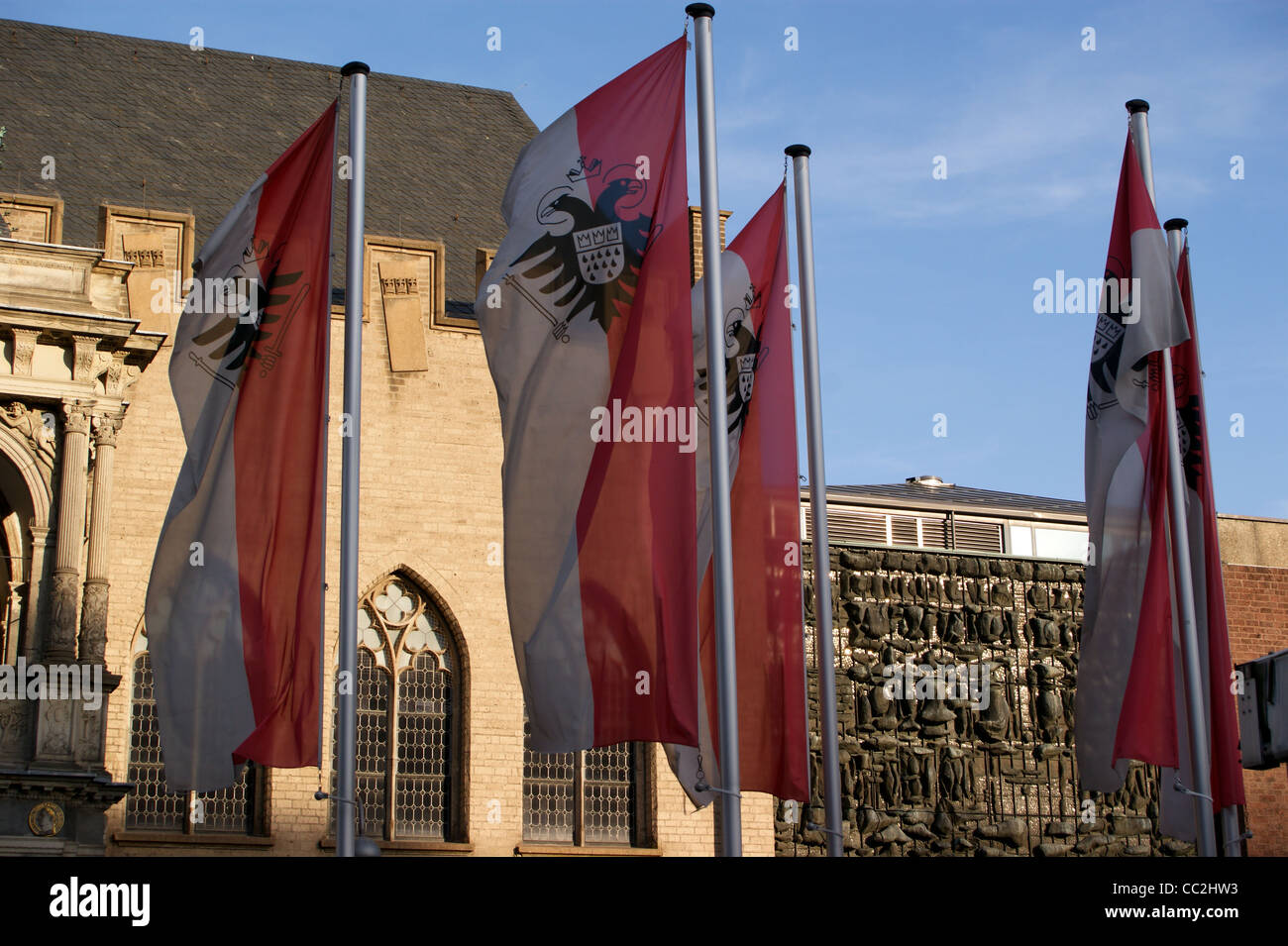 Standards, flags of the city of Cologne outside the Gothic Rathaus ...