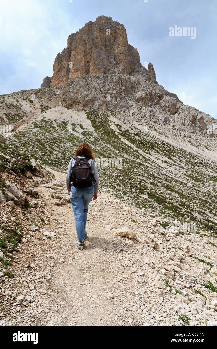 woman plays trekking on Catinaccio mountain, Italian Dolomites Stock ...