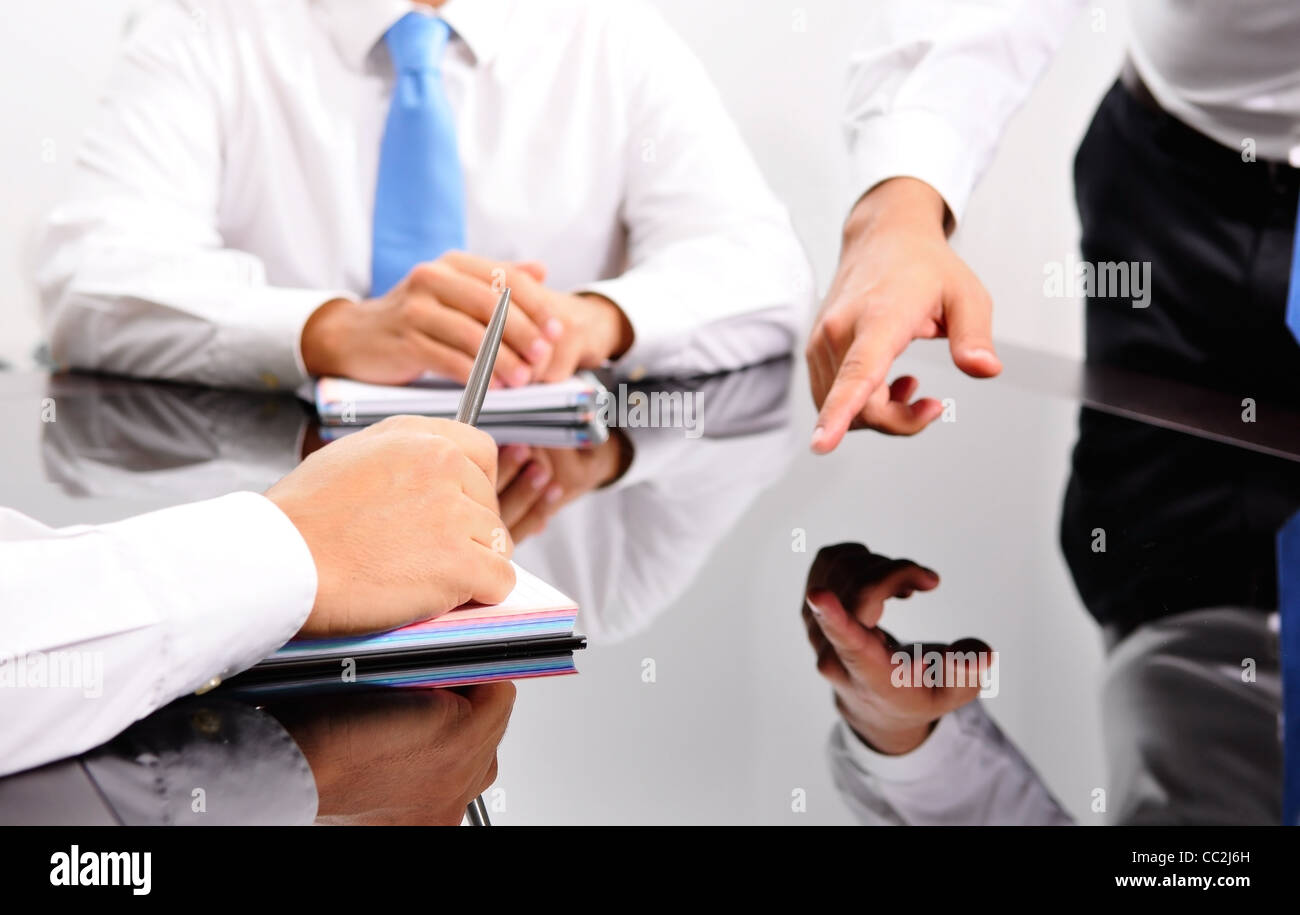 Business meeting between three businessmen Stock Photo - Alamy