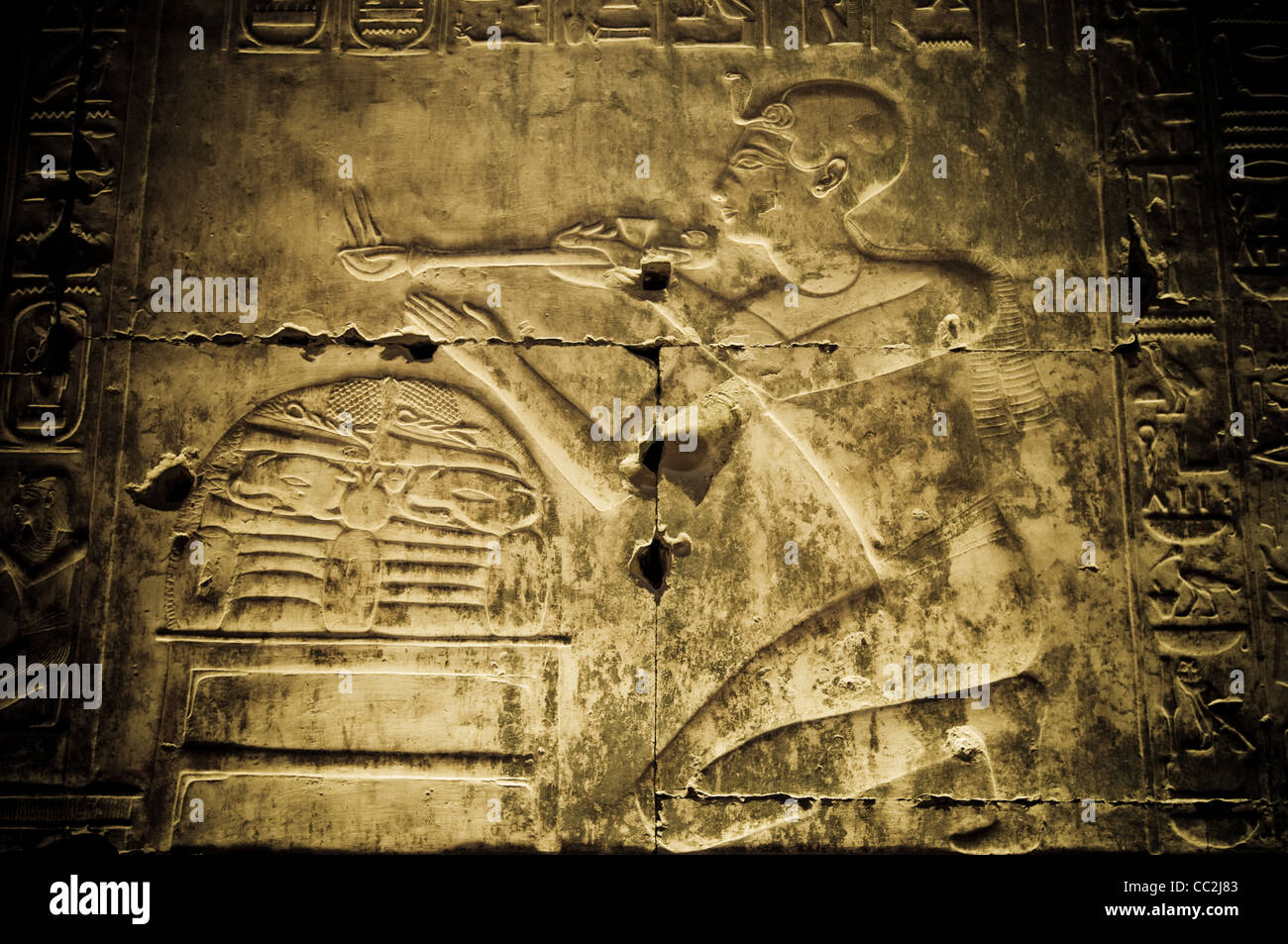 Wall relief portraying an Egyptian Pharaoh making offerings at Abydos ...