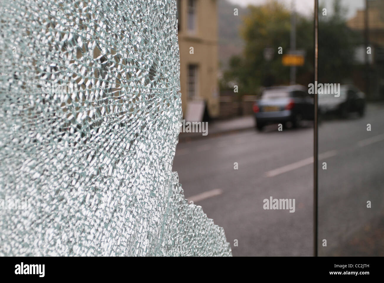 smashed glass at a bus stop Stock Photo - Alamy