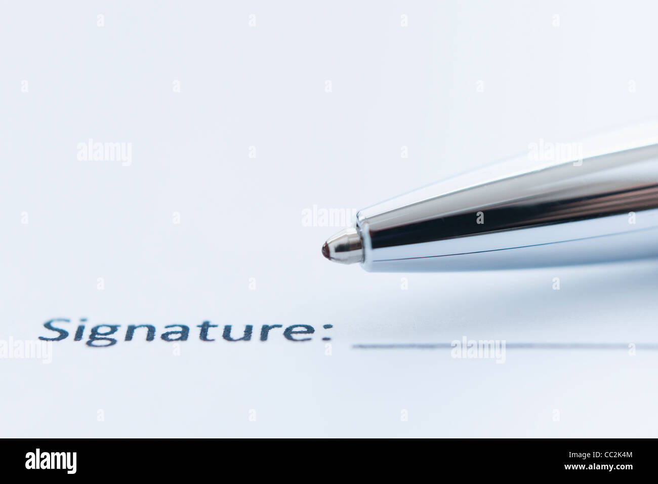 Detail of document with ballpoint pen, studio shot Stock Photo - Alamy