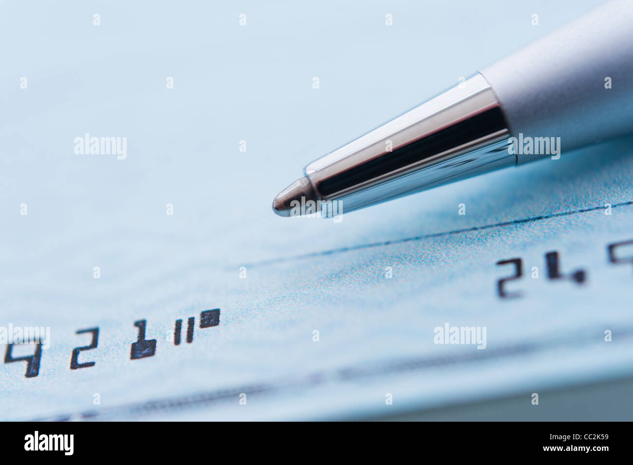 Detail of check with ballpoint pen, studio shot Stock Photo - Alamy