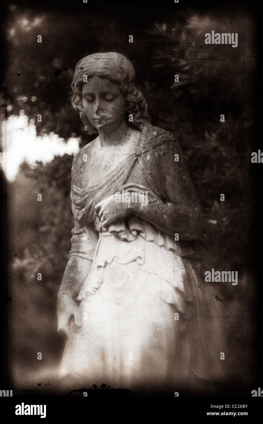 A female statue in cemetery Stock Photo - Alamy
