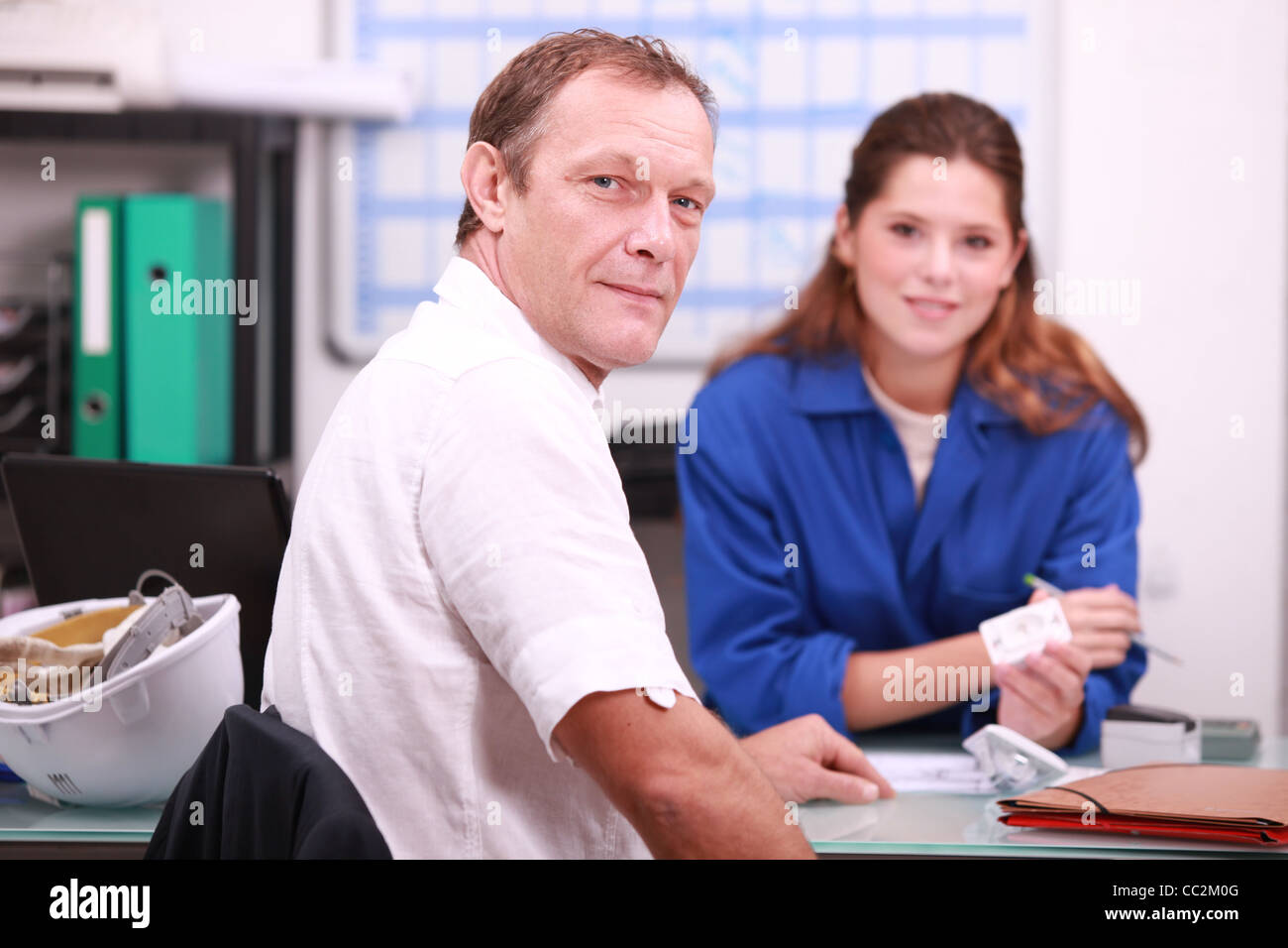 Two staff members taking inventory Stock Photo - Alamy