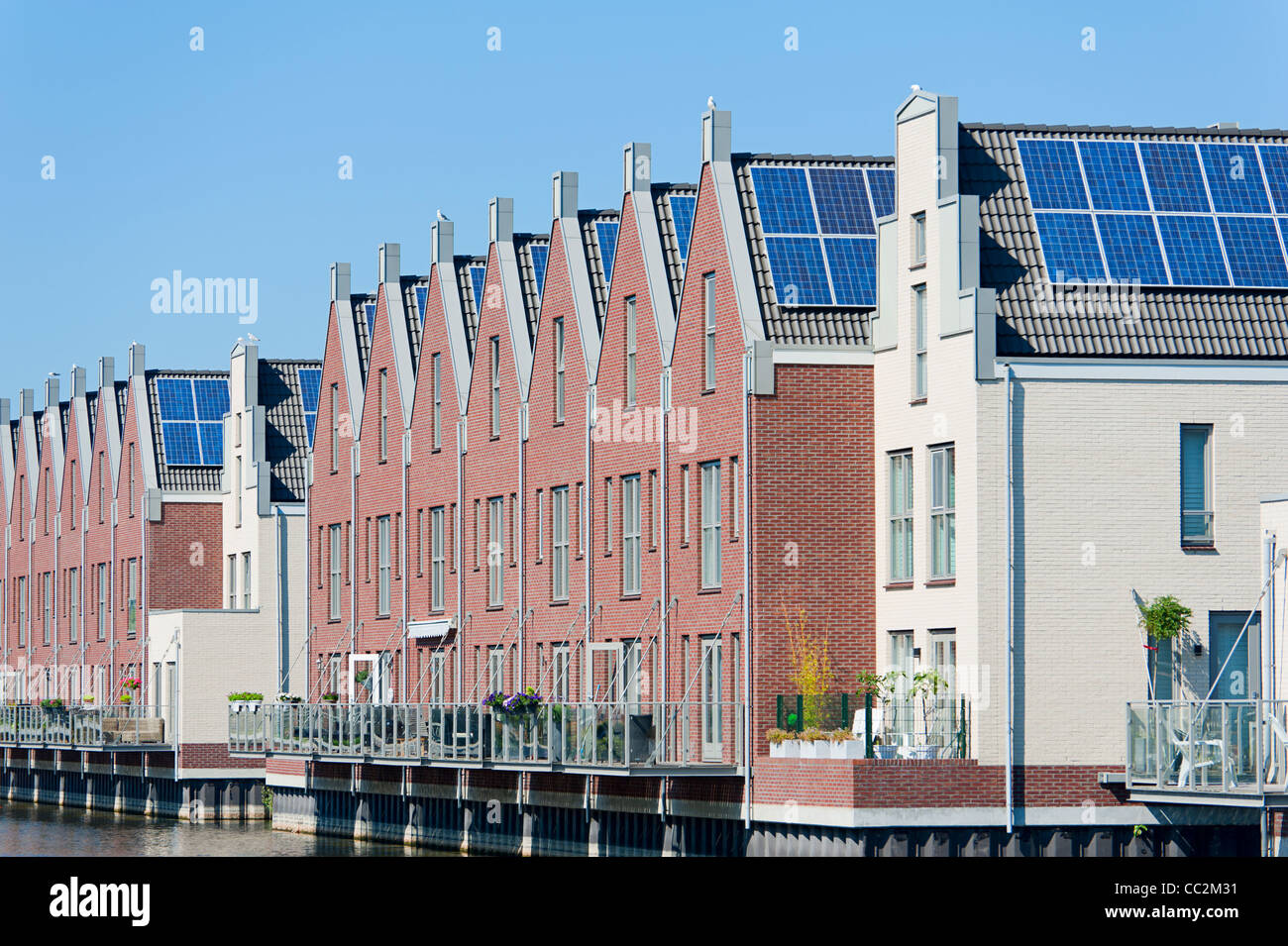Modern Dutch houses with solar panels on roof Stock Photo - Alamy
