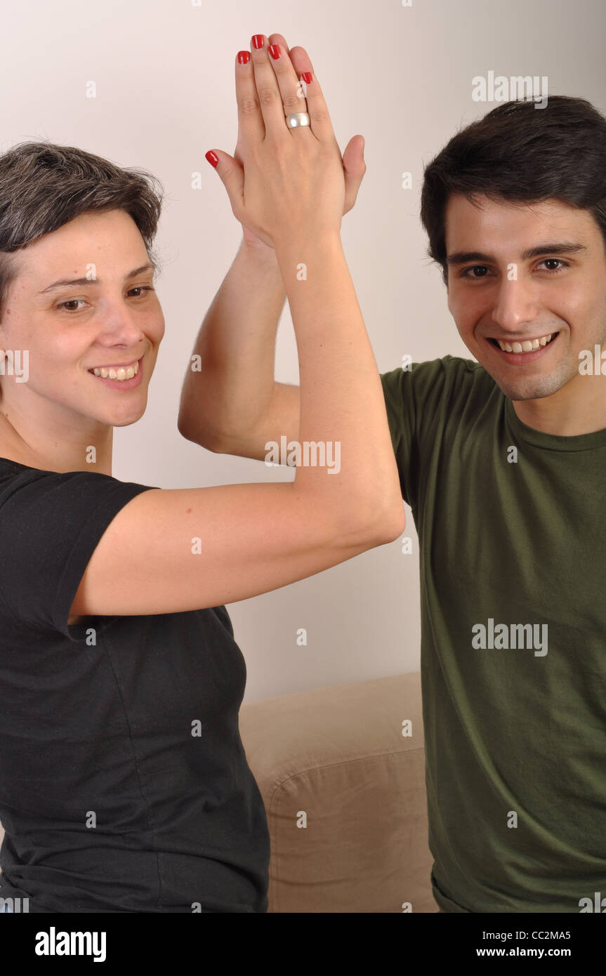 Sister and brother high five Stock Photo - Alamy