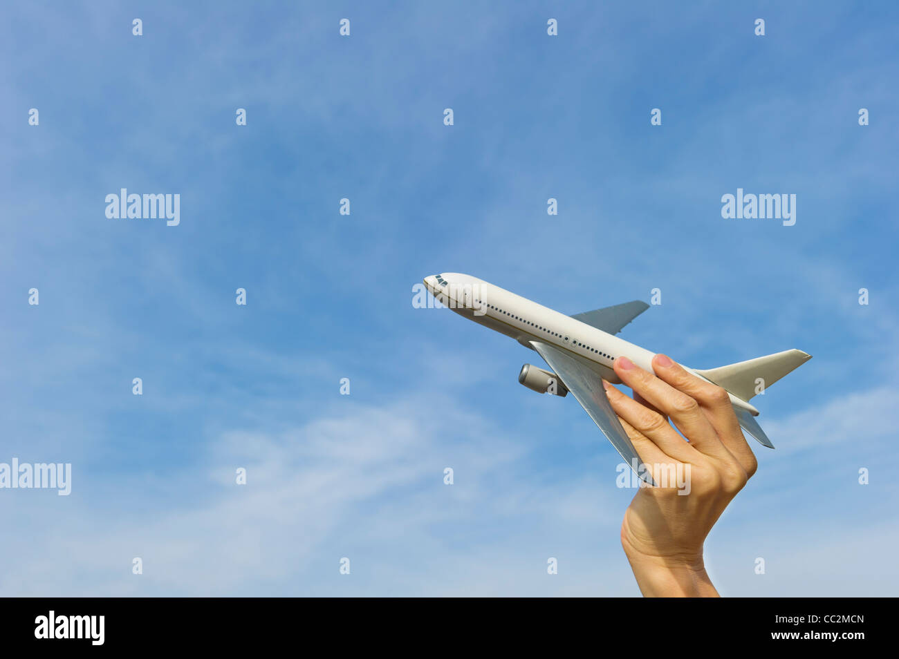 USA, New Jersey, Jersey City, Woman's hand holding plane model Stock ...