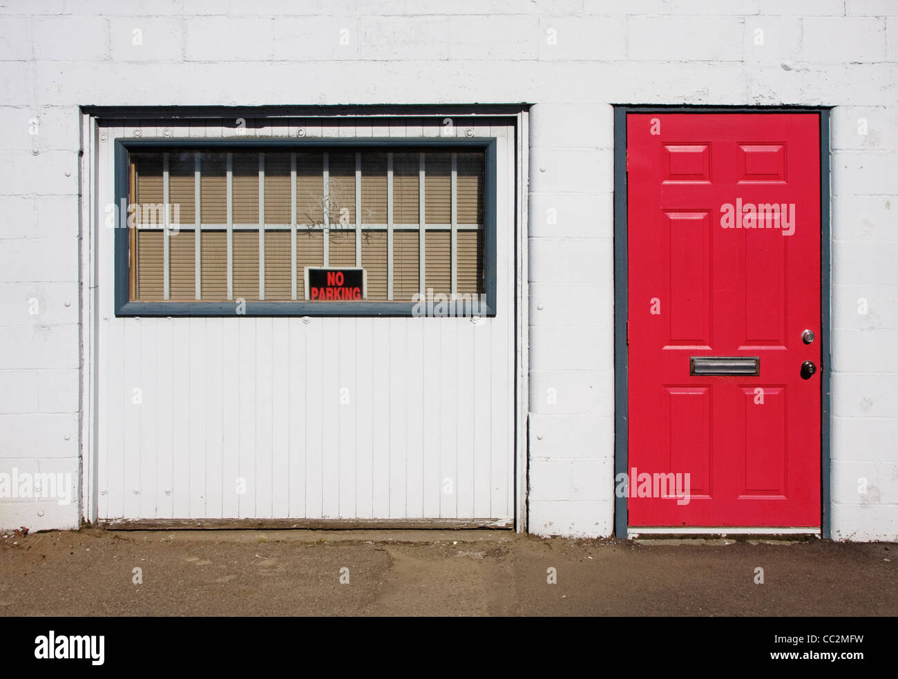 apartment front with red door and window Stock Photo - Alamy
