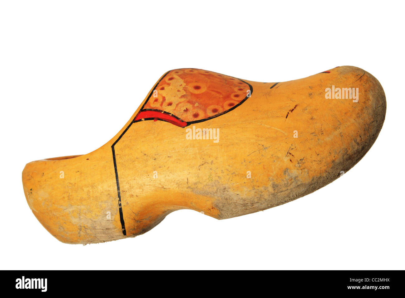 side view of old worn used dutch wooden shoe on white background Stock ...