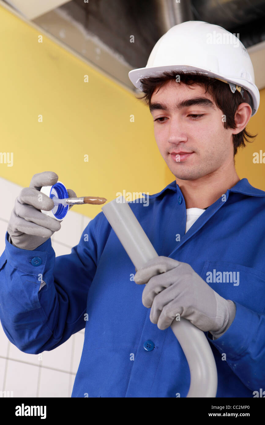 portrait of a young plumber Stock Photo - Alamy