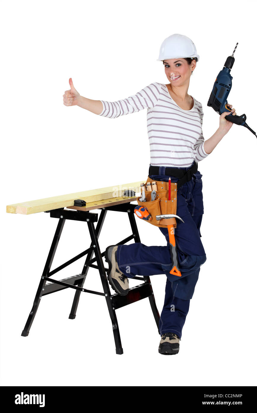 happy-looking female carpenter thumb up Stock Photo - Alamy