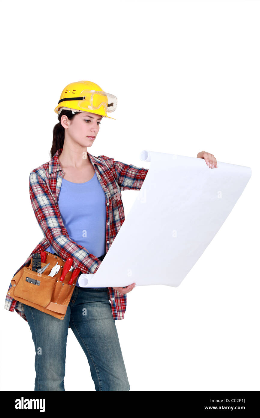 Female project manager examining plans Stock Photo - Alamy