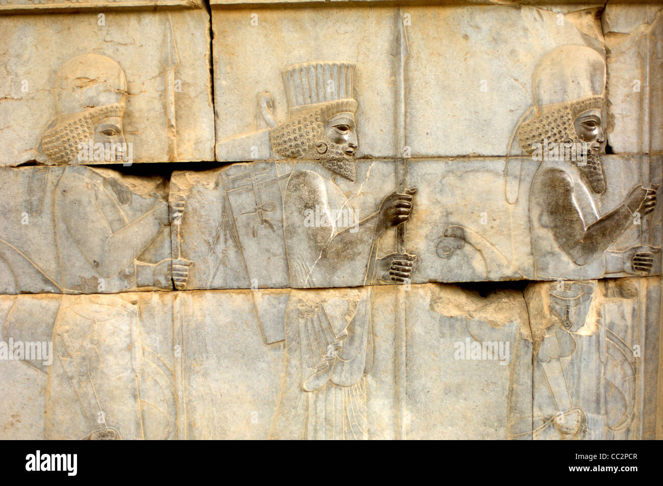 A carved relief on the walls of the ancient city of Persepolis built by ...