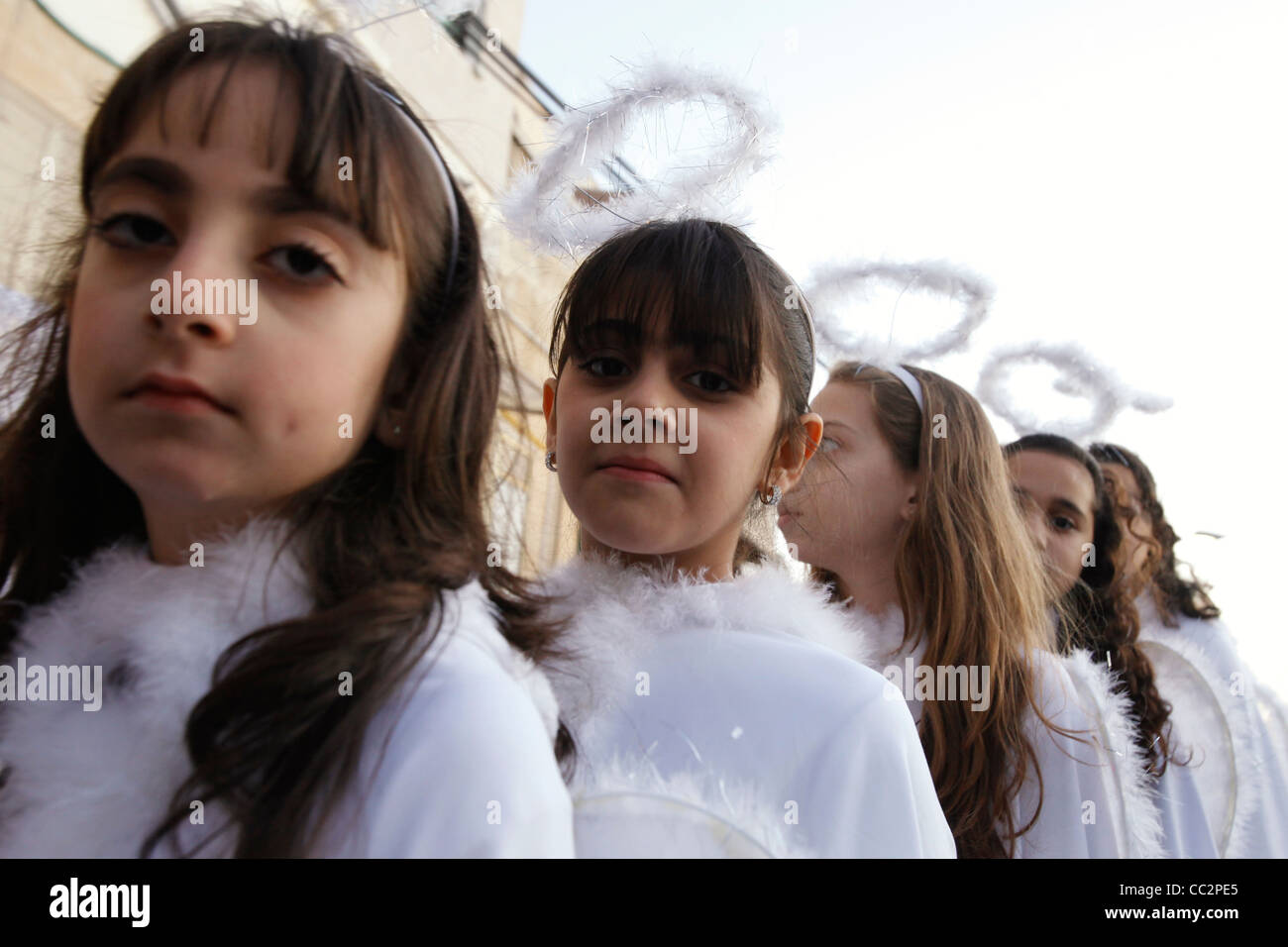 Young Israeli Arab Christian girls wearing angel costume take part in ...