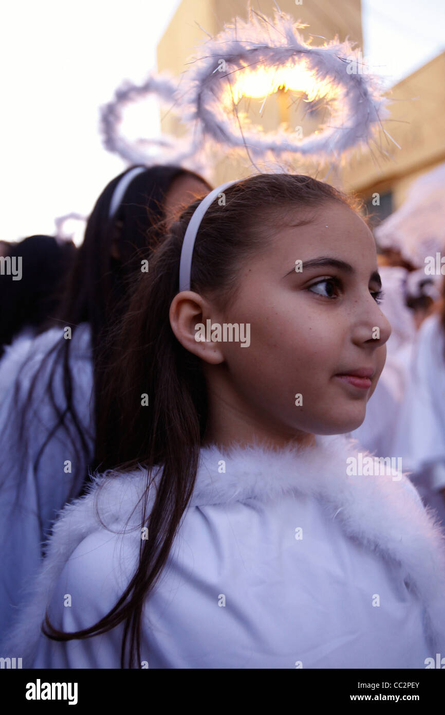 Young Israeli Arab Christian girls wearing angel costume take part in ...
