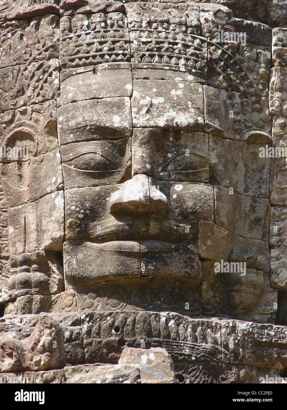 One of the faces of Angkor Tom at the Cambodian temples of Angkor Stock ...