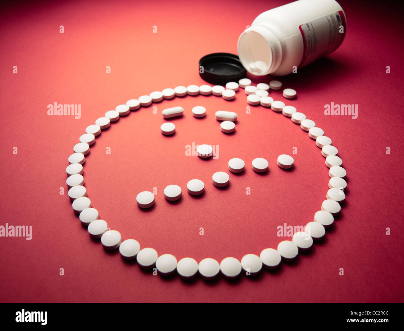 angry face made out of pills and drugs coming out of a bottle Stock ...