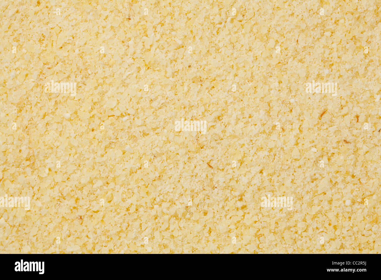 background of yellow semolina wheat flour at life-size magnification ...