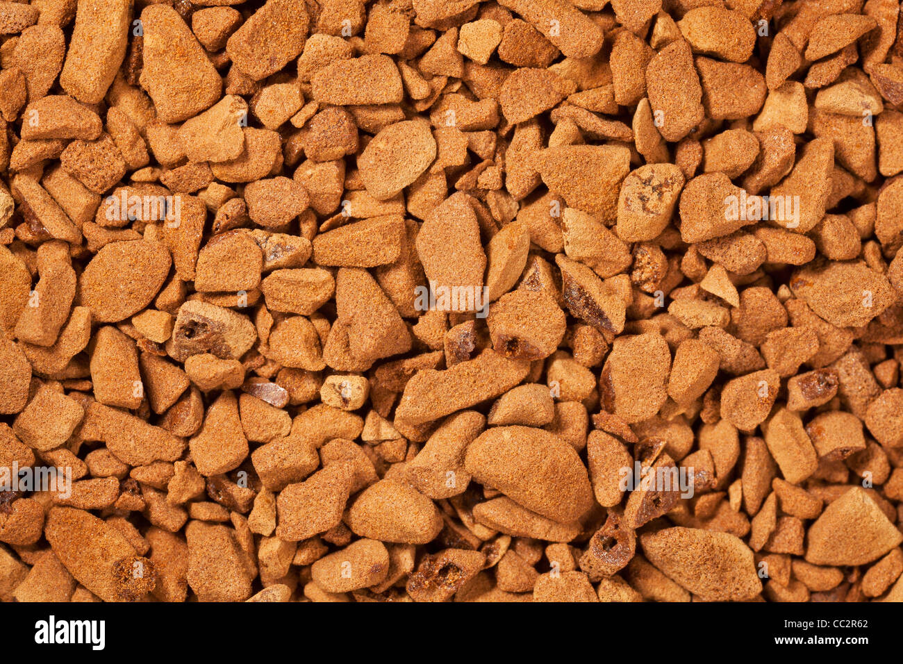 background of instant coffee granules at life-size magnification Stock ...