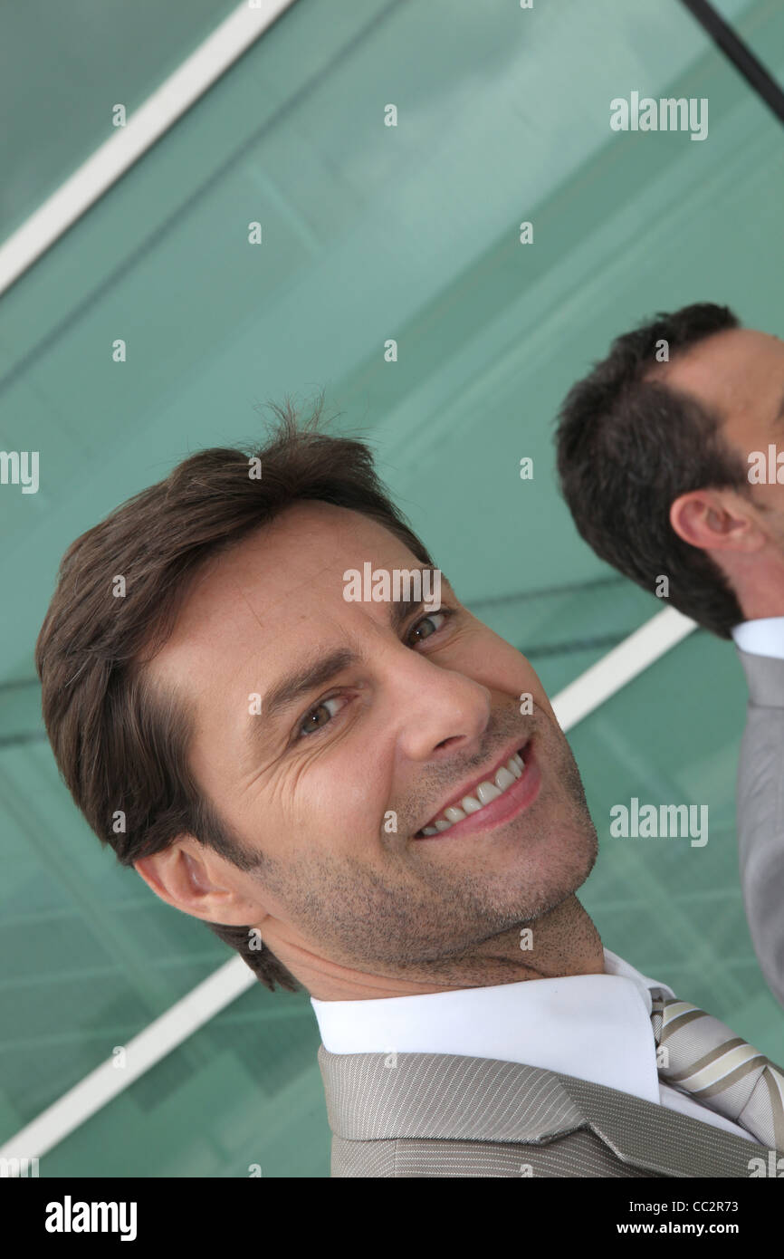 Headshot happy male employee outside office building Stock Photo - Alamy