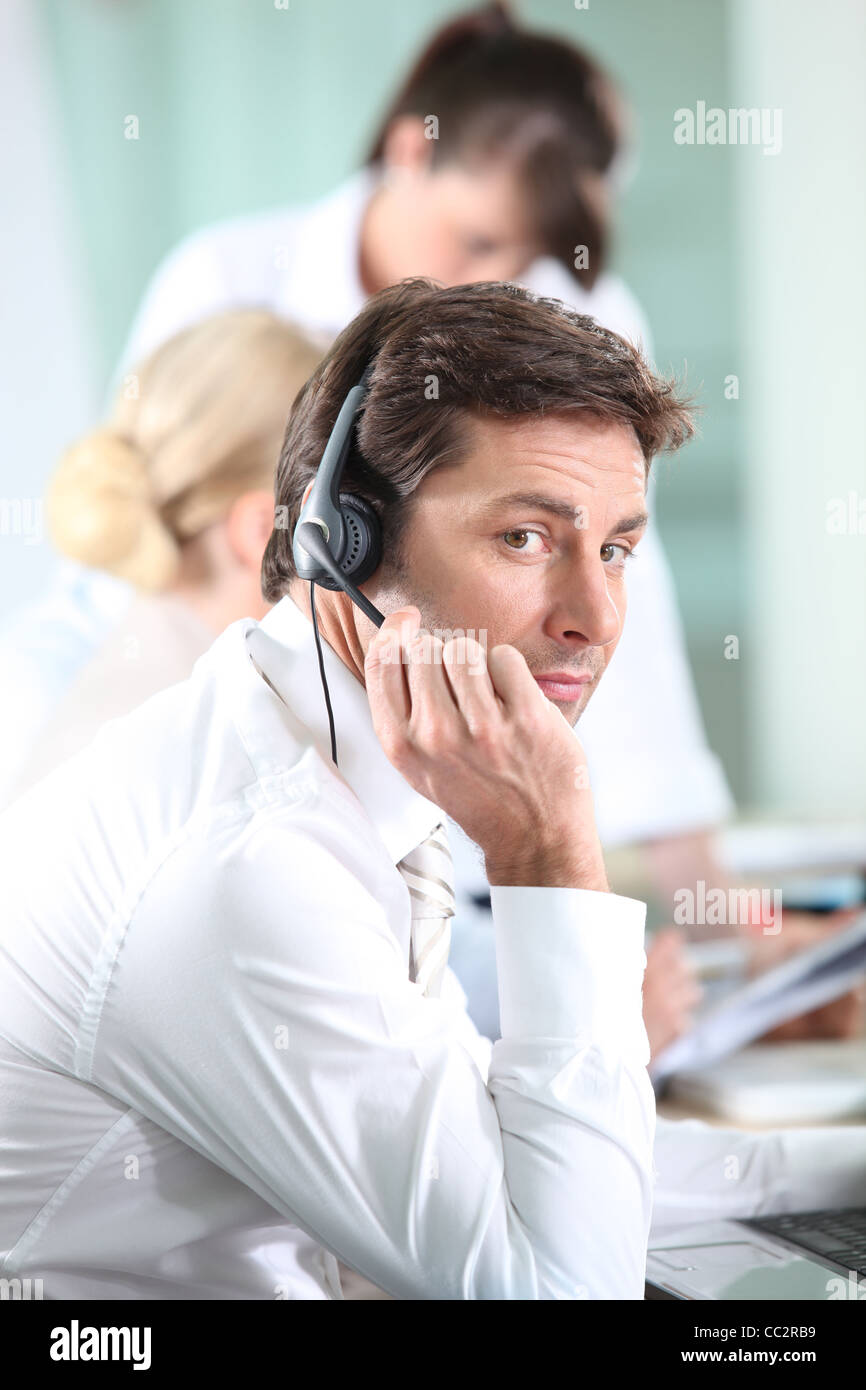 Male call centre worker Stock Photo - Alamy