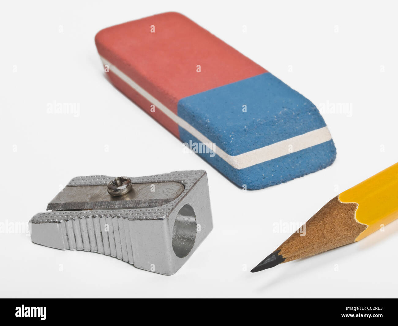 a sharpened pencil, beside are a sharpener and a eraser Stock Photo - Alamy