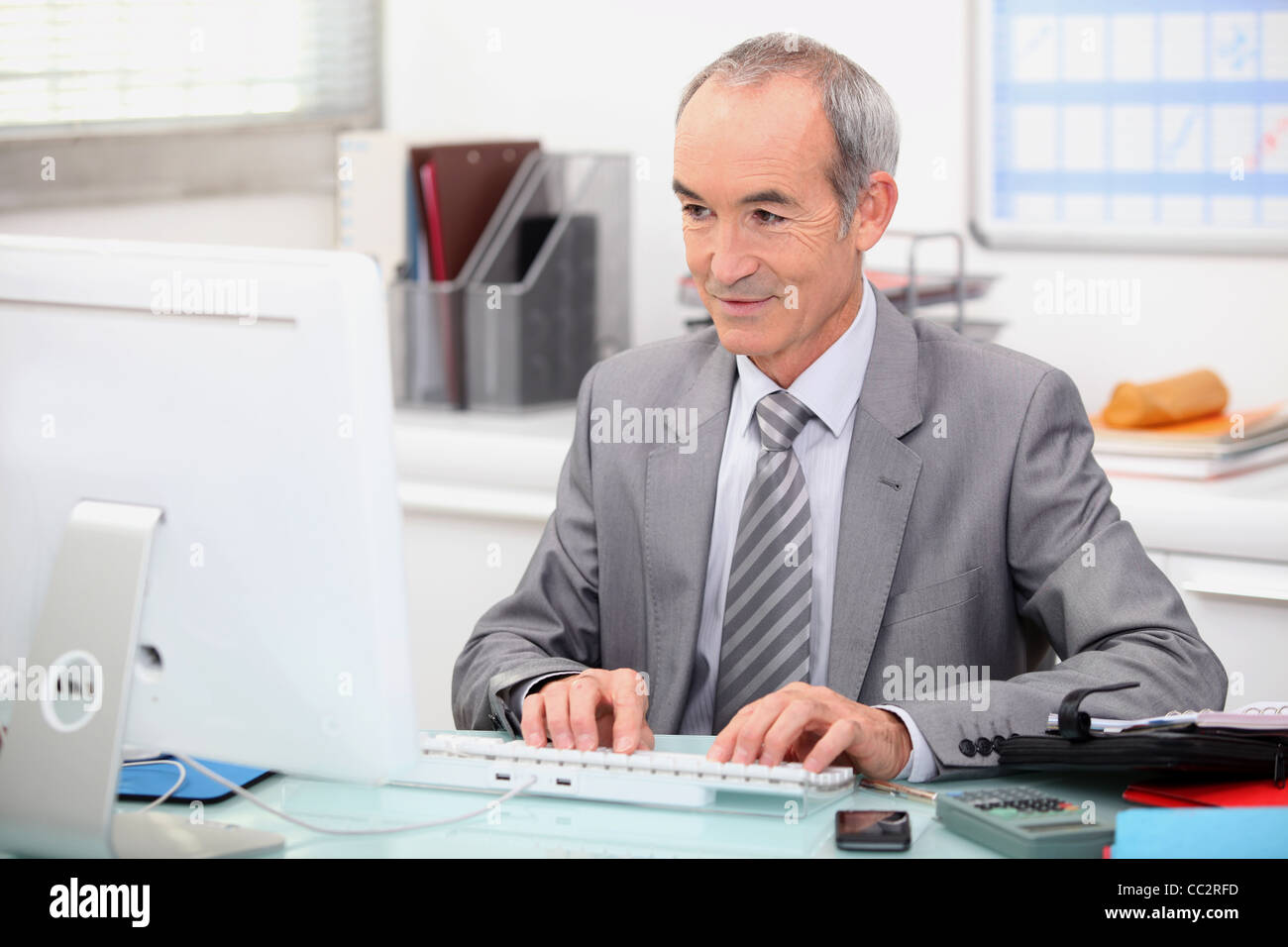 Elderly man at work Stock Photo - Alamy