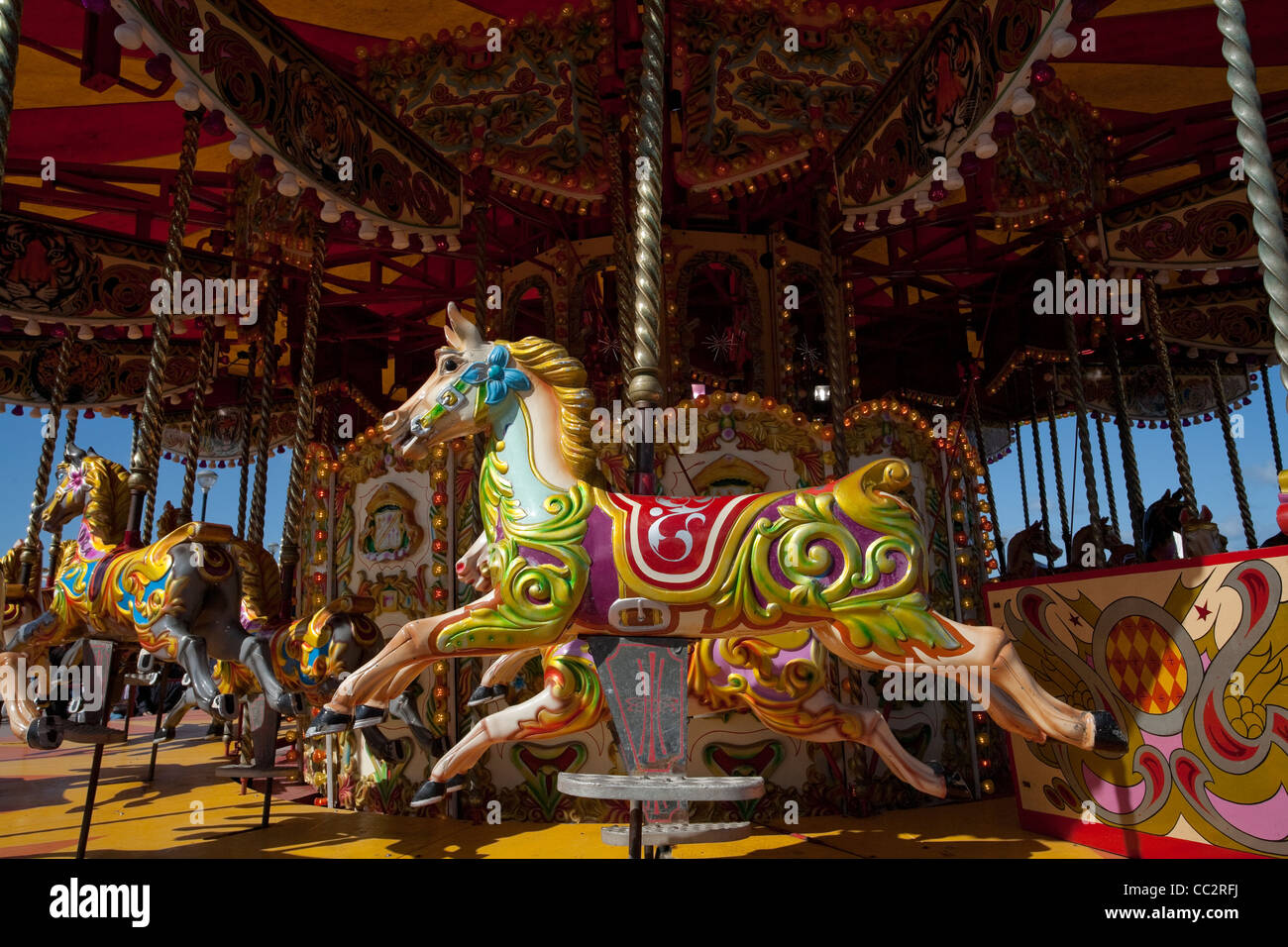 Classic carousel with wooden horses Stock Photo - Alamy