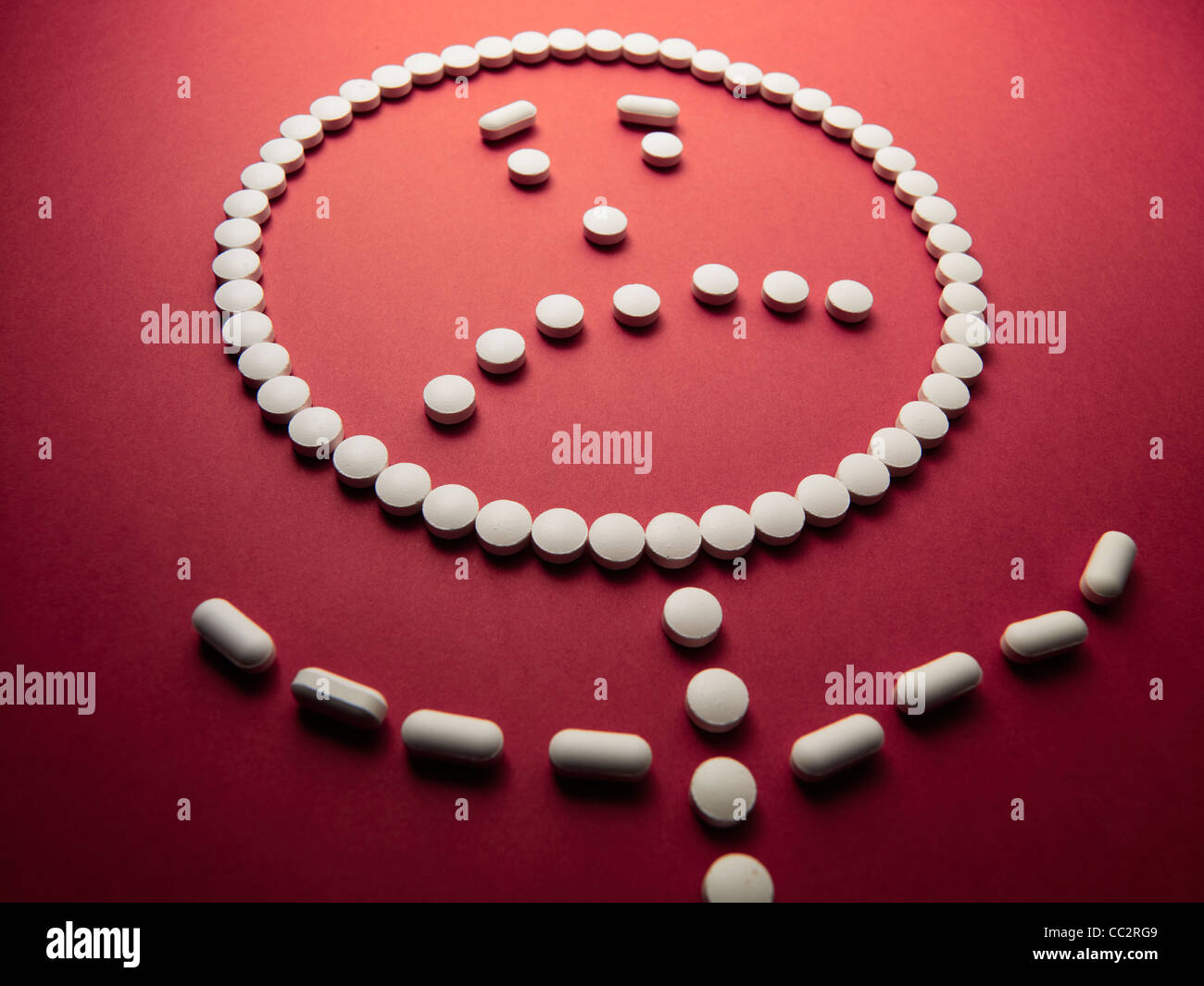 unhappy face made out of pills and drugs Stock Photo - Alamy