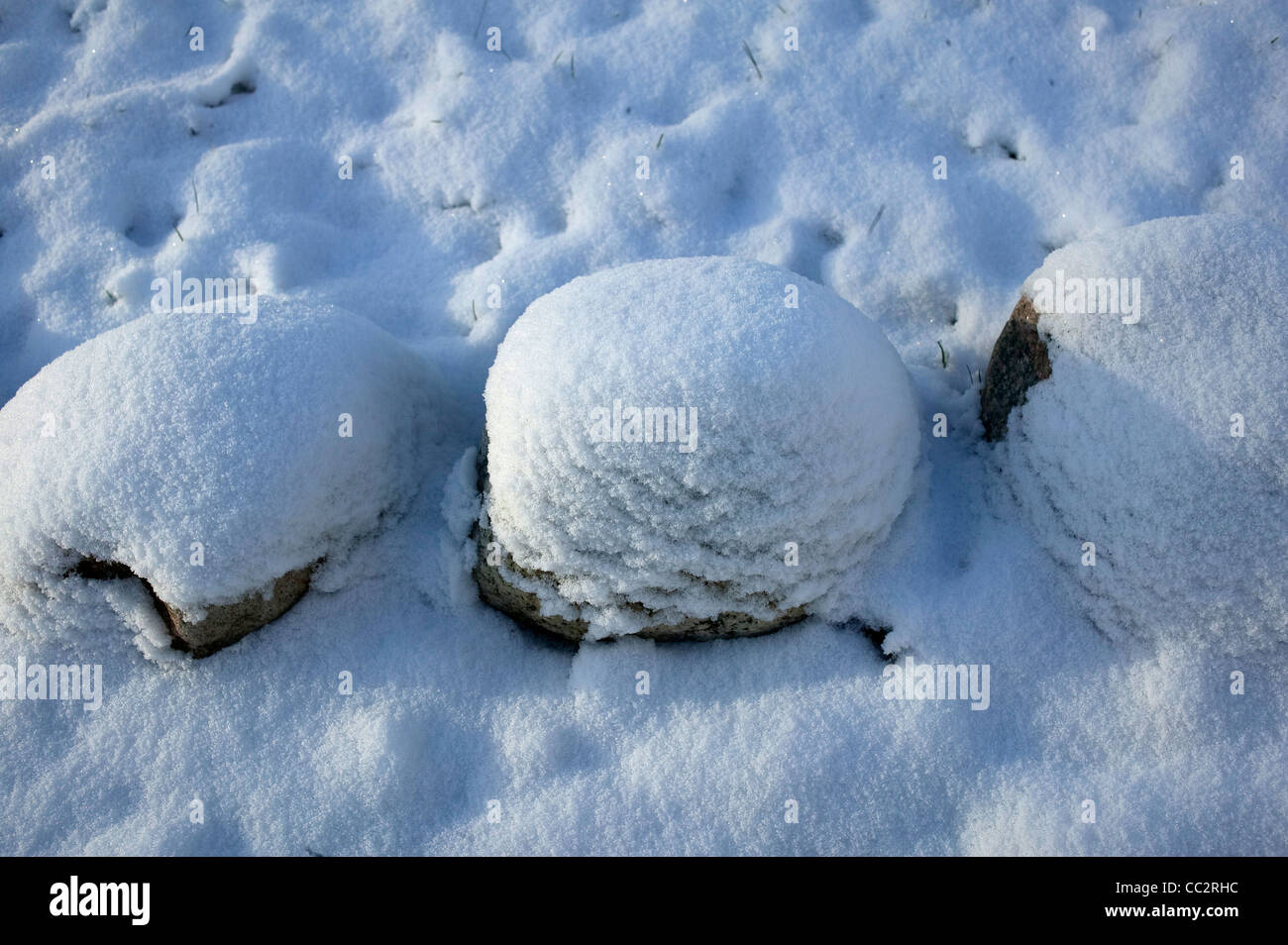 Large stones covered of snow Stock Photo - Alamy
