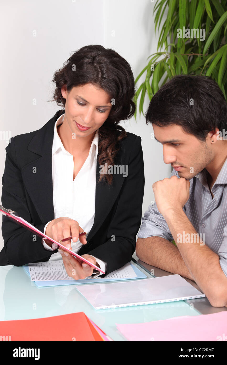 Two office workers brainstorming Stock Photo - Alamy