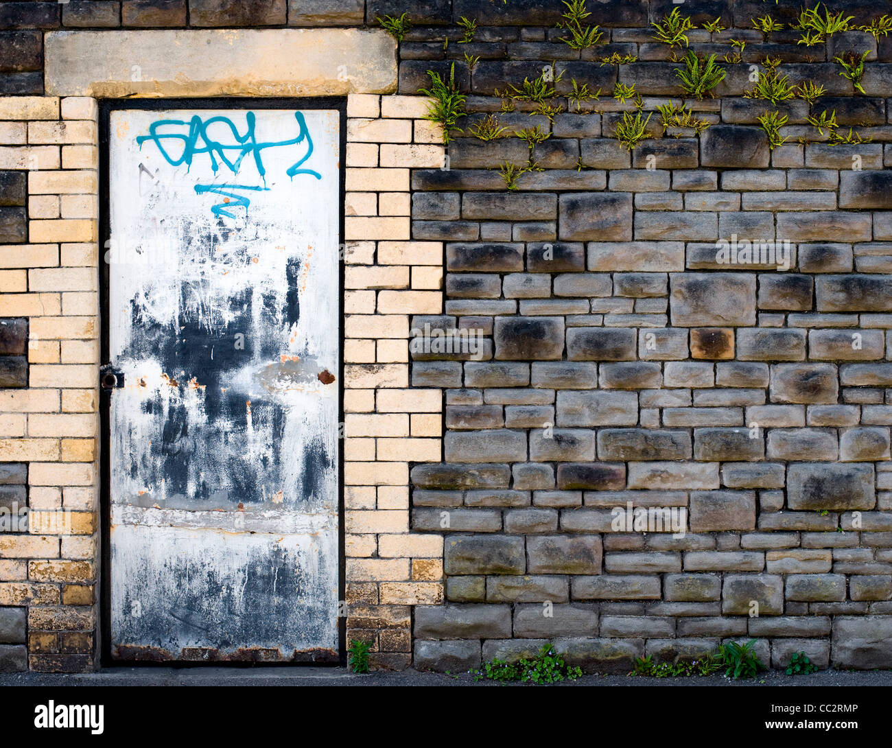 Derelict door with graffiti Stock Photo - Alamy