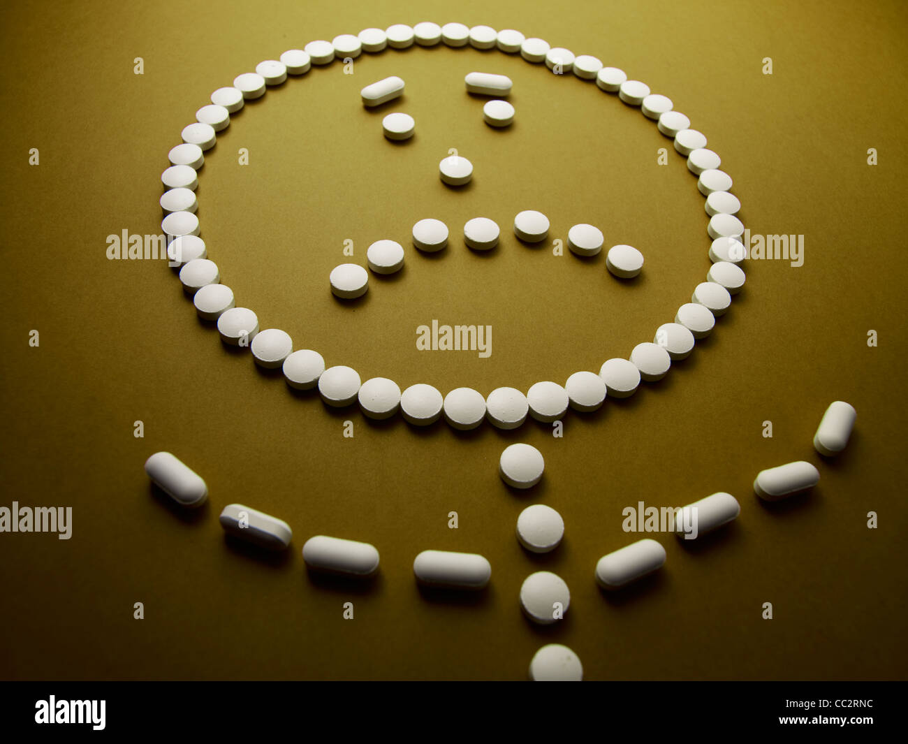 unhappy face made out of pills and drugs Stock Photo - Alamy
