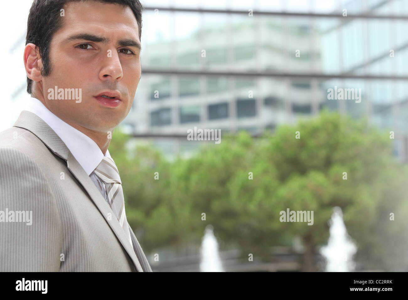 Young businessman looking concerned Stock Photo - Alamy