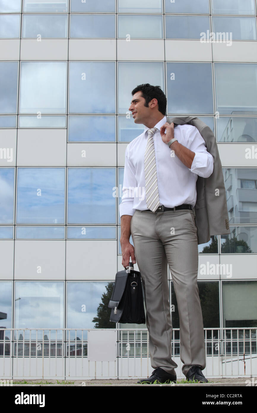 Man standing outside with his briefcase Stock Photo - Alamy
