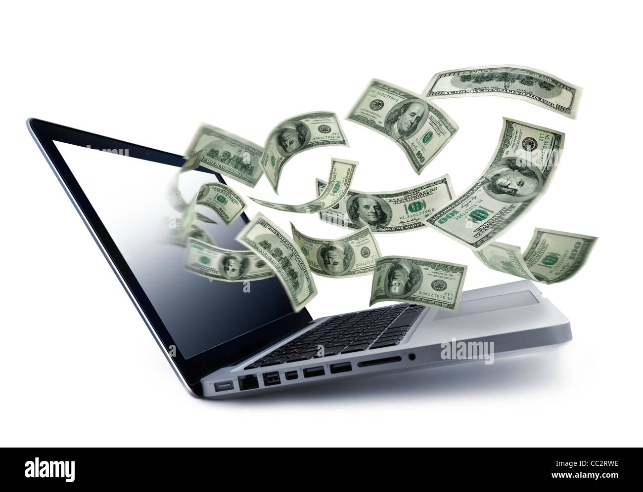 Money pouring out from a notebook computer Stock Photo - Alamy