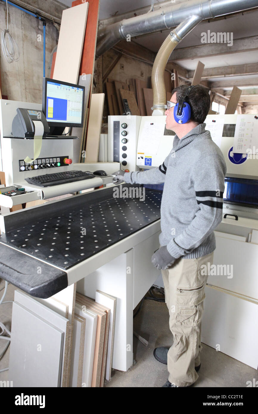 Man working in a factory Stock Photo - Alamy