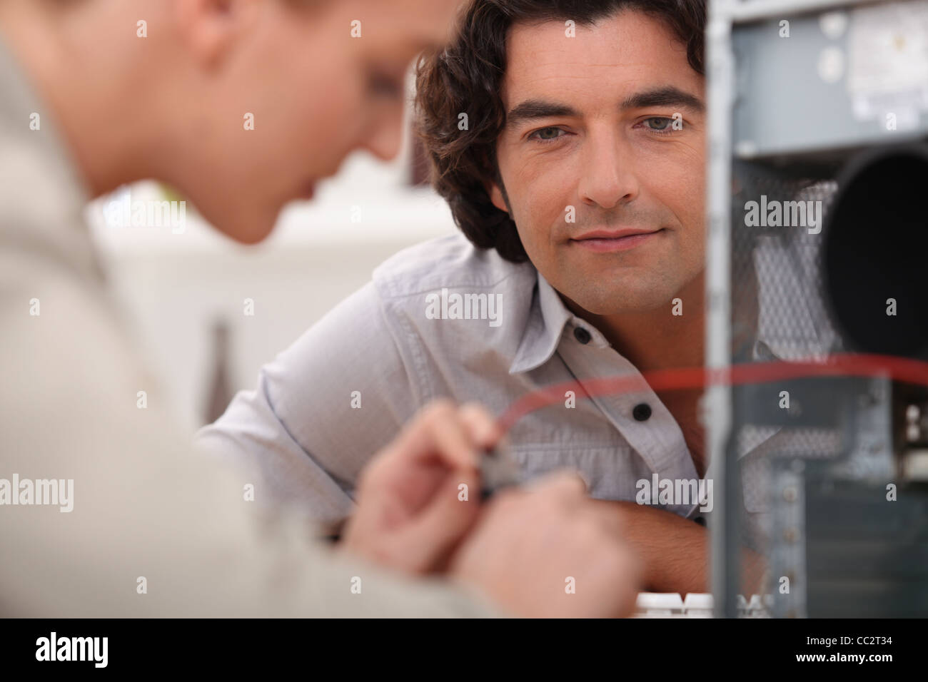 Woman repairing computer Stock Photo - Alamy