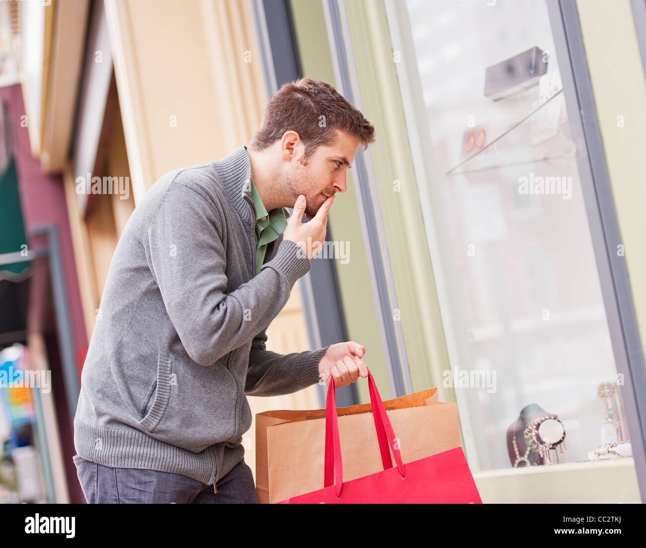 USA, New Jersey, Jersey City, Man looking at window display Stock Photo ...