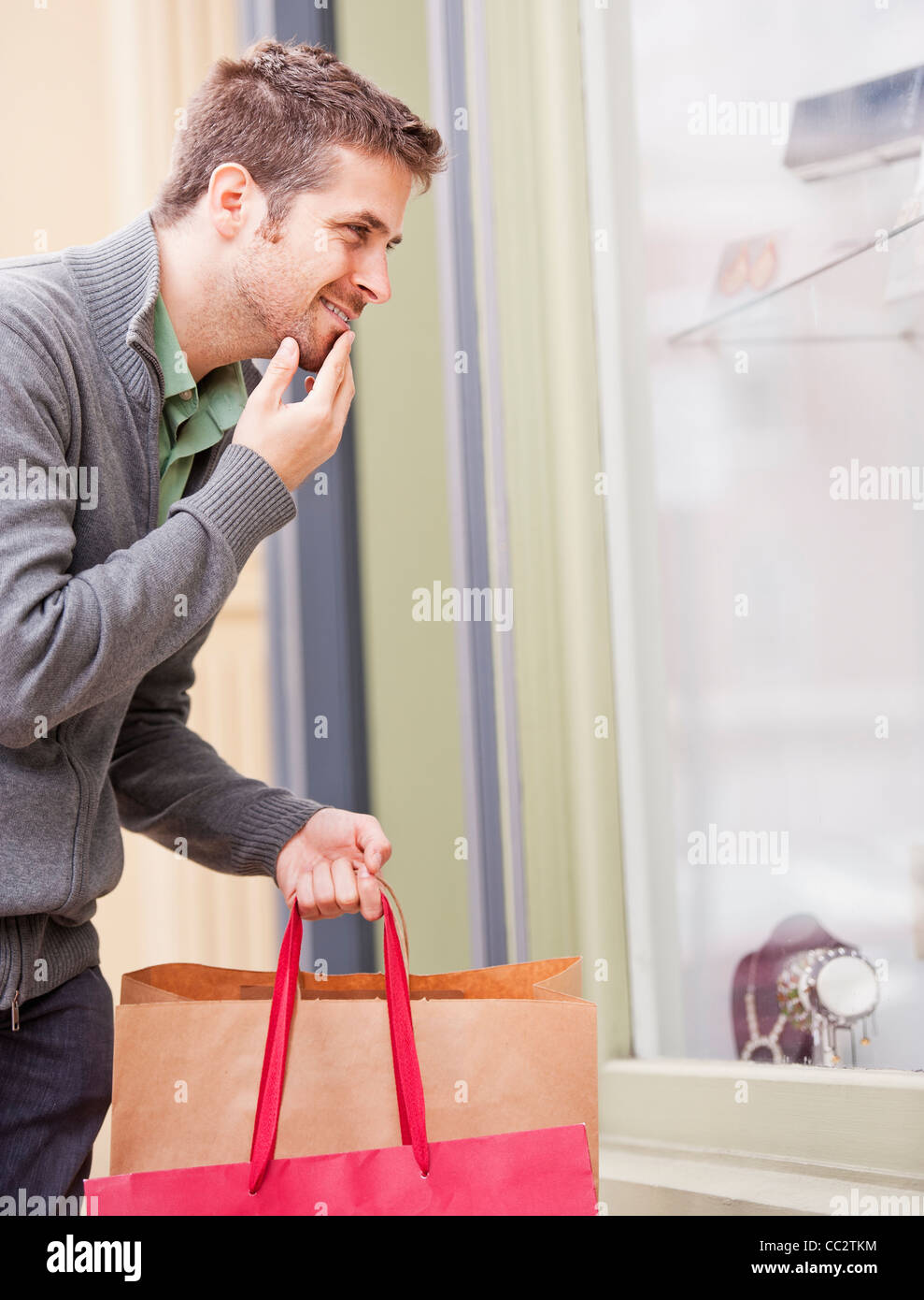 USA, New Jersey, Jersey City, Man looking at window display Stock Photo ...
