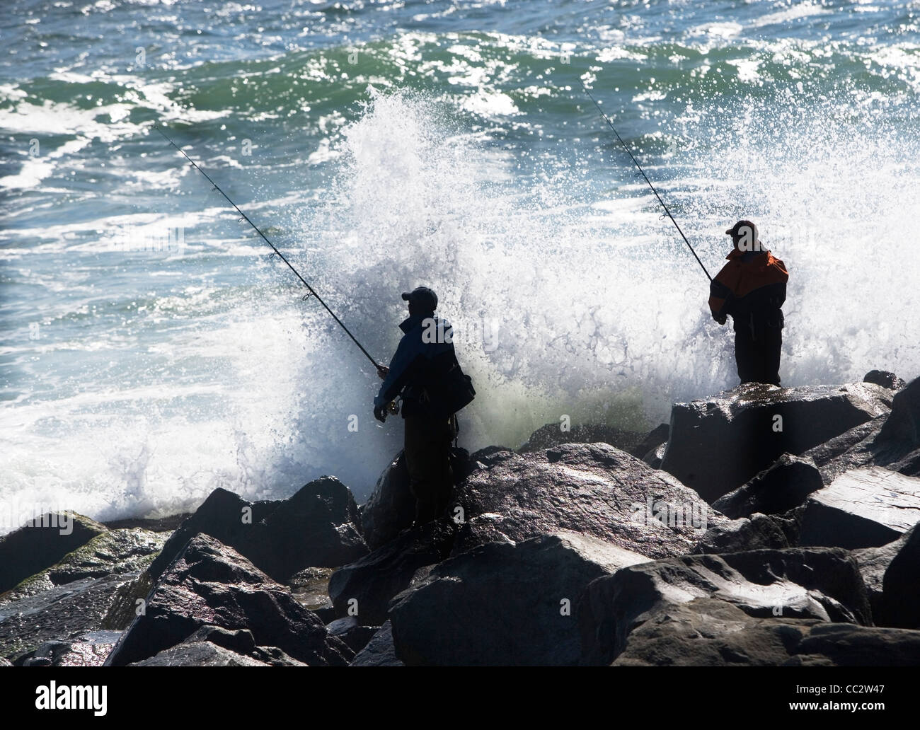 Silhouette two men sea fishing hi-res stock photography and images - Alamy